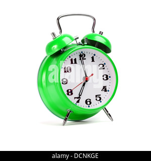 Classic alarm clock on a green background Stock Photo - Alamy