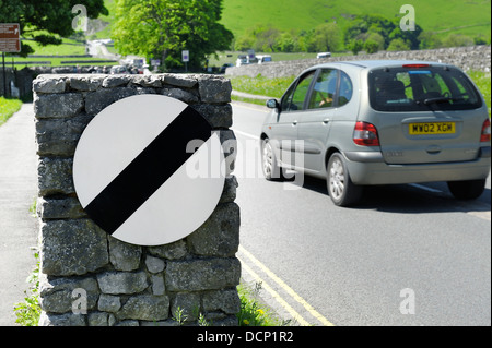National speed limit traffic sign UK on an open countryside rural road ...