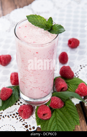 Fresh made Raspberry Milkshake on wooden background Stock Photo - Alamy