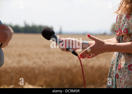 A journalist is making a interview with a farmer Stock Photo: 59527783 ...
