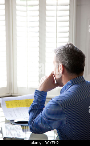 Examination paper on the office desk Stock Photo - Alamy