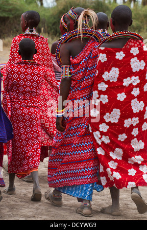 Masai women wearing traditional dress, in a village near the Masai ...