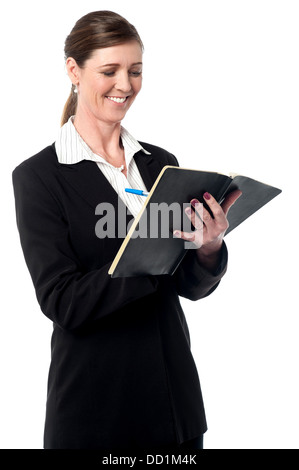 Corporate woman marking her schedule Stock Photo - Alamy