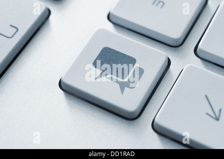 Speech bubble key button on the keyboard. Toned Image Stock Photo - Alamy