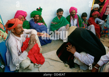 Propitiatory ritual performed by a traditional healer ( the man under ...