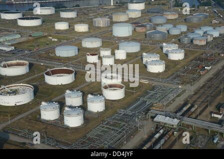 A refinery of Shell with giant oil tanks located on the premise is ...