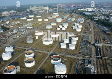 A refinery of Shell with giant oil tanks located on the premise is ...