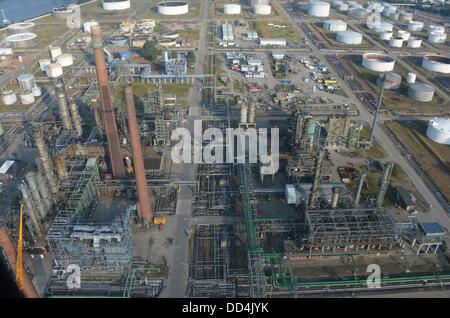 A refinery of Shell with giant oil tanks located on the premise is ...