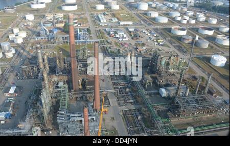 A refinery of Shell with giant oil tanks located on the premise is ...