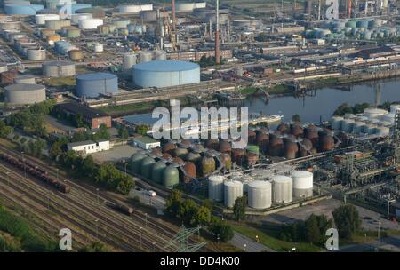 A refinery of Shell with giant oil tanks located on the premise is ...