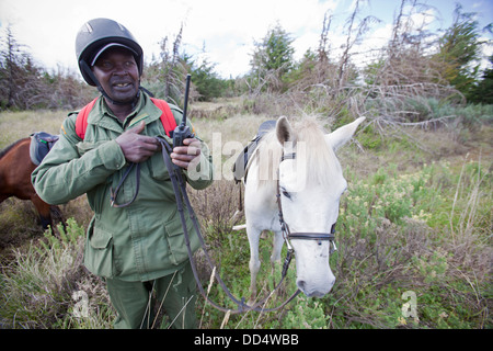 Anti-poaching horseback patrol unit ride through gate to enter Mount ...