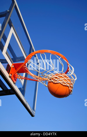 Basketball falling through the net Stock Photo - Alamy