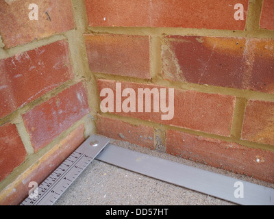 Bad brickwork badly laid bricks Stock Photo - Alamy