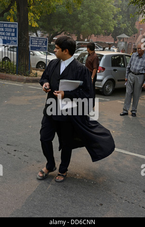 An Indian lawyer at the main entrance to the Supreme Court of India in ...