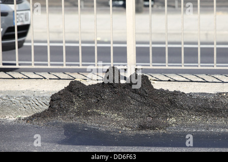 THE WAVE LIKE SHAPE OF THE MELTED TARMAC IN THE CITY CENTRE OF ...