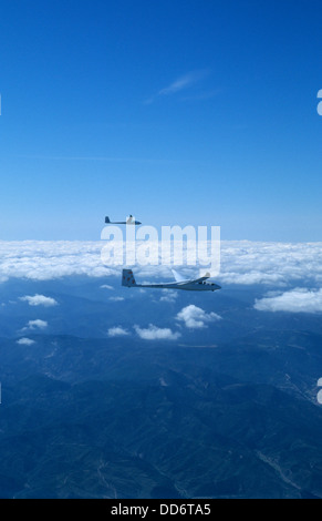 Two glider planes Duo Discus flying over clouds in wave flight near ...