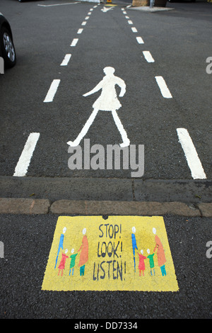 Stop look listen safety road sign at railway train station danger ...