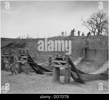 Commando training exercises at Camp Carson, Colorado, are shown ...
