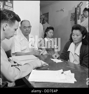 Evacuees at the Poston Relocation Center in Arizona stand in line at ...