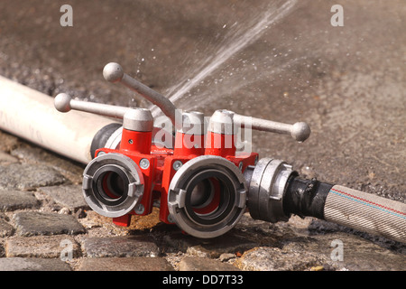 Fire hydrant hose connection fire fighting equipment Stock Photo - Alamy