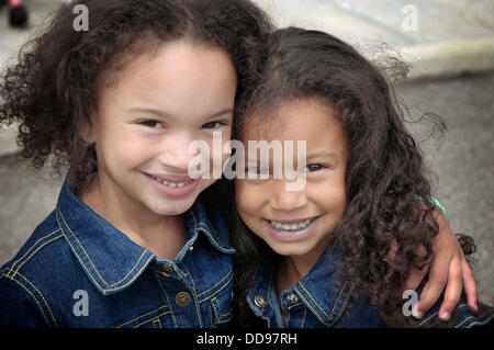 Twin Sisters who look alike dress alike and act alike as twins at the ...