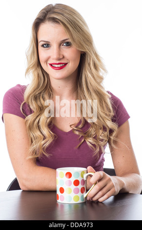 Attractive young woman drinking tea with her mother at home Stock Photo ...