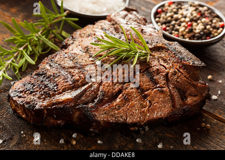 Grilled juicy beef steak with rosemary, fried meat, close-up. Top Blade ...