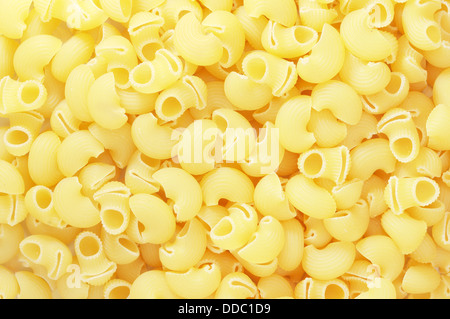 Italian Pipe Rigate Macaroni Pasta raw food background or texture close ...