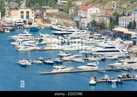 seafront with ships at pier Balaclava Town, Crimea, Ukraine Stock Photo ...
