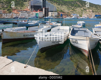 seafront with boats and ships at pier (Balaclava Town, Crimea Stock ...