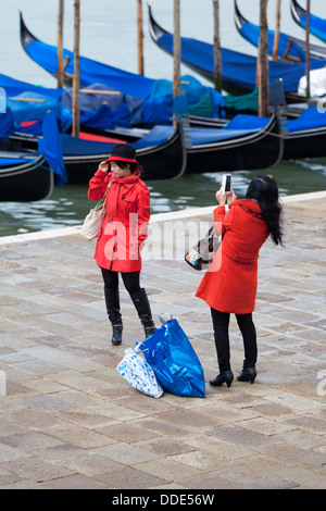 Asian women photographing each other in Venice, Italy Stock Photo - Alamy