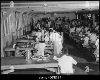 A photo of mealtime at the Manzanar Relocation Center, a World War II ...