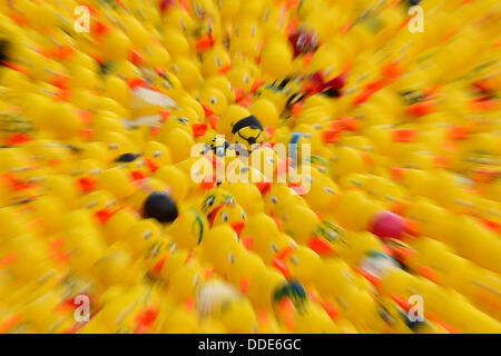 More than 12,000 rubber ducks are thrown into the water during the ...