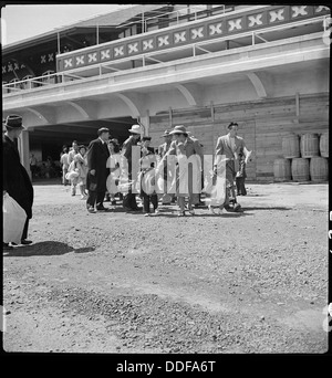 Families of Japanese ancestry arrive at the Tanforan Race Track ...