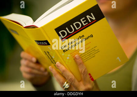 ILLUSTRATION - An illustrated picture shows a Duden lying on a table in ...