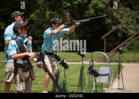 A competitor takes his shot during a trap shooting competition in Bella ...