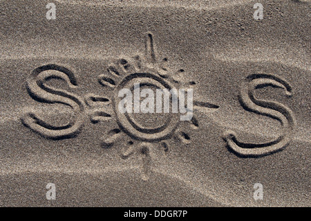 S.O.S written in the sand with a finger or stick Stock Photo - Alamy
