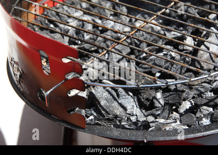 detail of portable small round barbecue grill in garden Stock Photo - Alamy