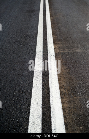Road marking - Double lines on the asphalt road Stock Photo - Alamy