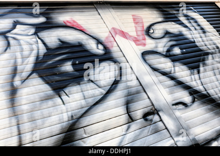 Artistic graffiti on a shutter Stock Photo - Alamy