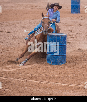 Cowgirl Participant in a Barrel racing competition at the Helldorado ...