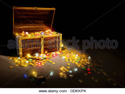 Open treasure chest overflowing with jewellery, elevated view Stock ...