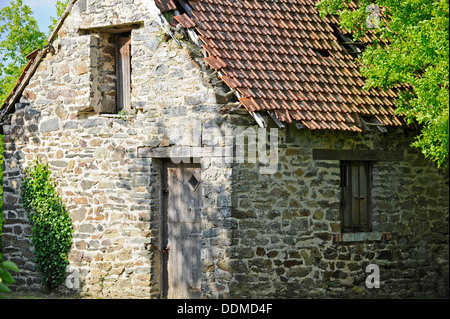 Traditional stone built barn and roman style roof tiles Stock Photo - Alamy