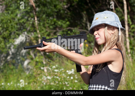 little girl firing a big gun Stock Photo - Alamy