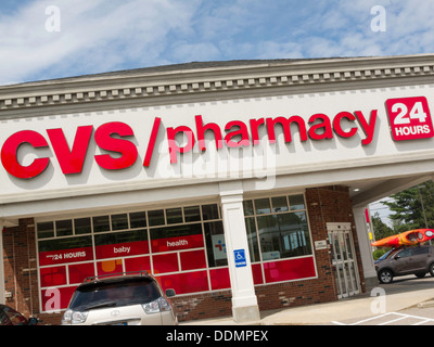 A logo sign outside of a CVS Pharmacy retail store location in ...