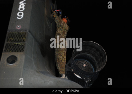 Staff Sgt. Ernie Botello, a CH-47 Chinook helicopter flight engineer ...