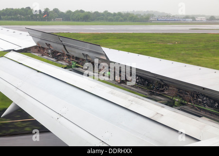 aircraft wing spoiler deployed during landing showing hydraulics Stock ...