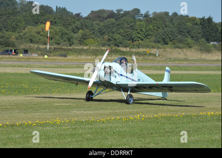 A biplane landing at an airstrip in Shoreham England Stock Photo - Alamy