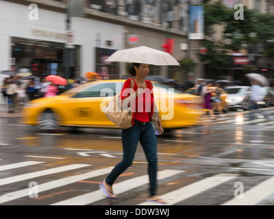 Pedestrians under Brollies in Rainstorm at Herald Square, NYC Stock ...