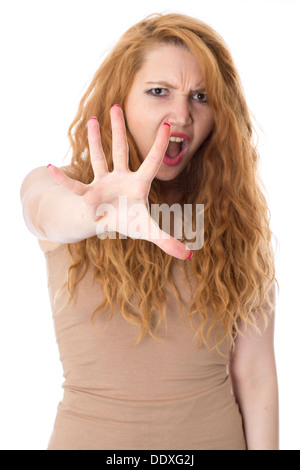 Young attractive woman blocking with hand. Pretty girl signalling to ...